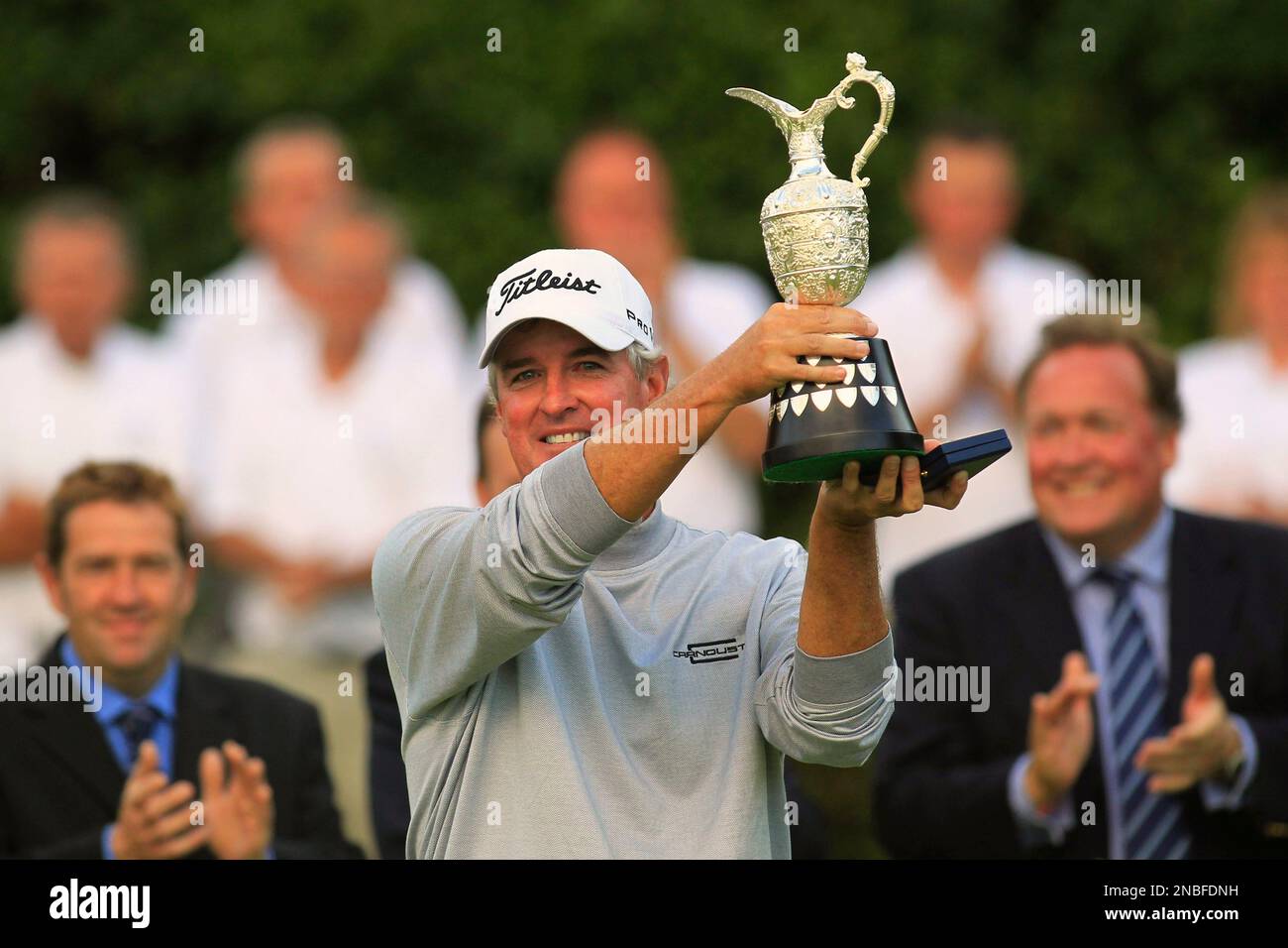 Russ Cochran of the U.S. raises the trophy after winning the Senior ...