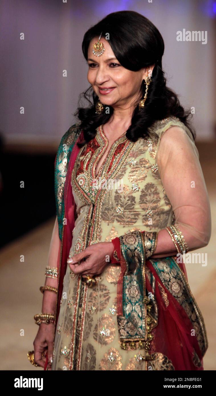 Bollywood actor Sharmila Tagore displays a creation of Indian designers ...