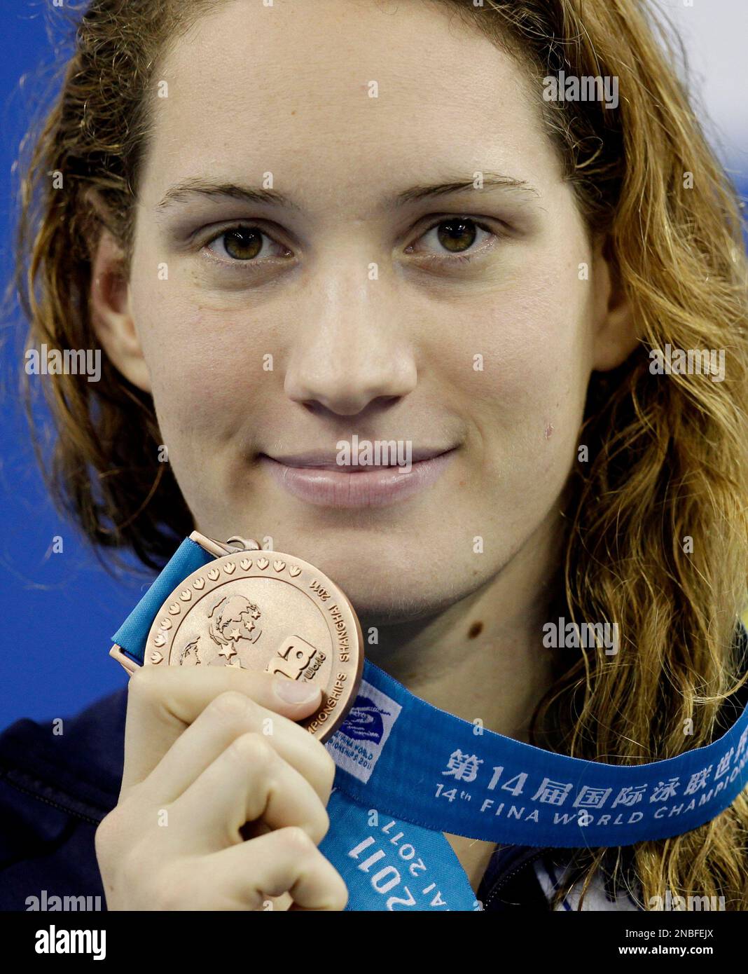 France's Camille Muffat shows the bronze medal she won in he women's ...
