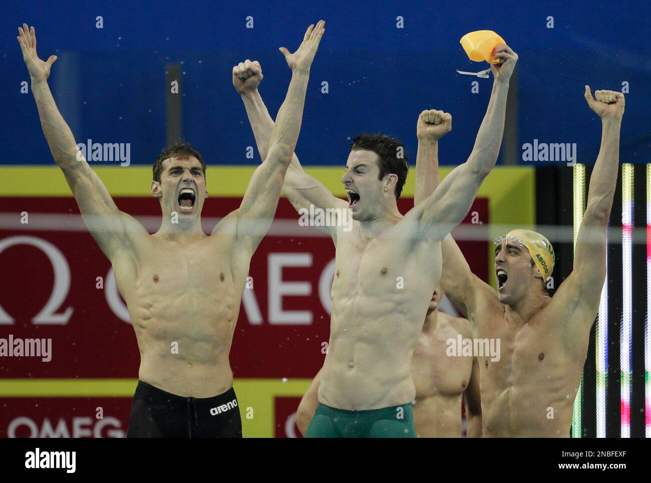 The Australian men's relay team members celebrate after winning the ...