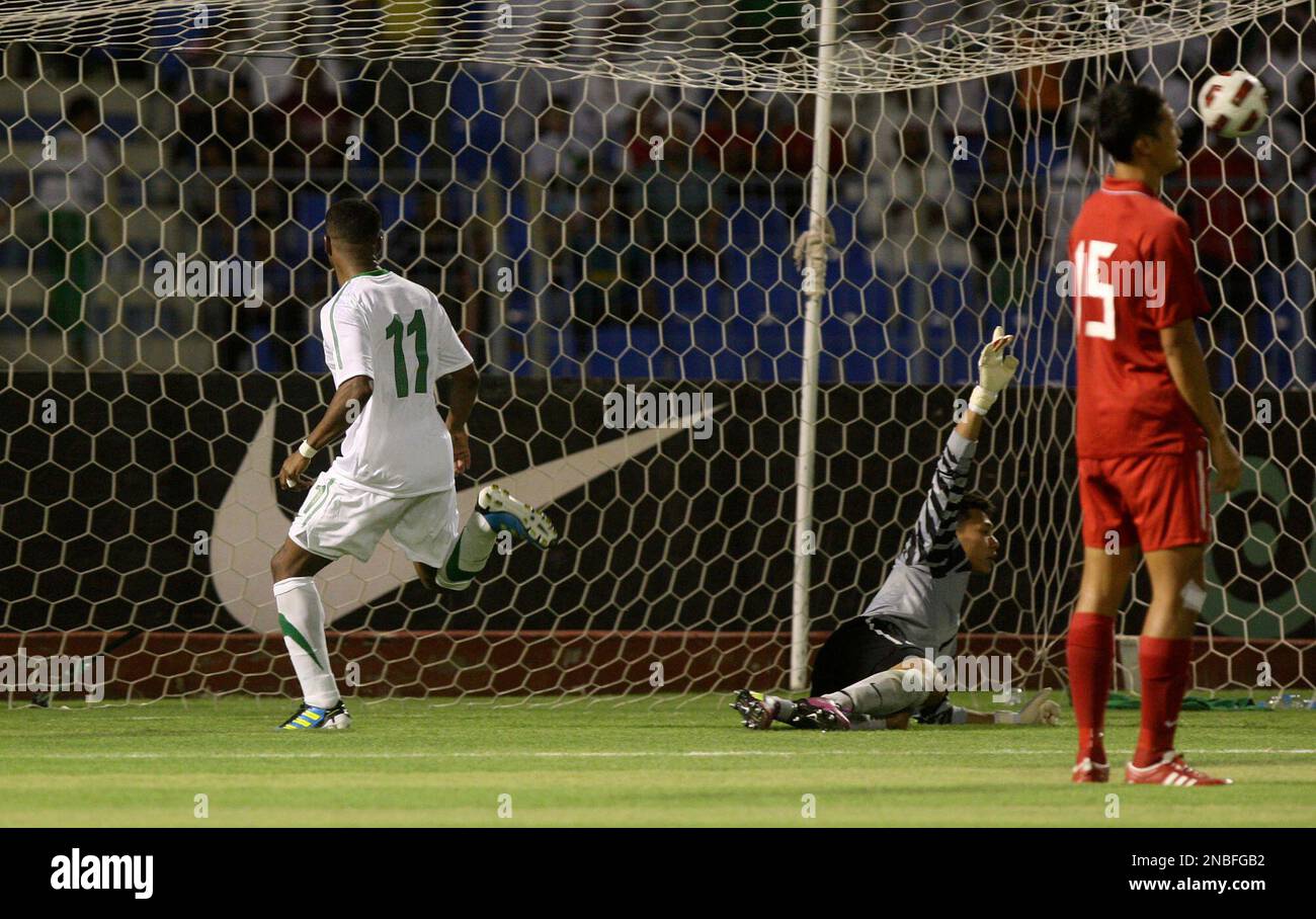 Saudi Arabia's soccer player Nasser Al Shamrani, left, scores a goal ...
