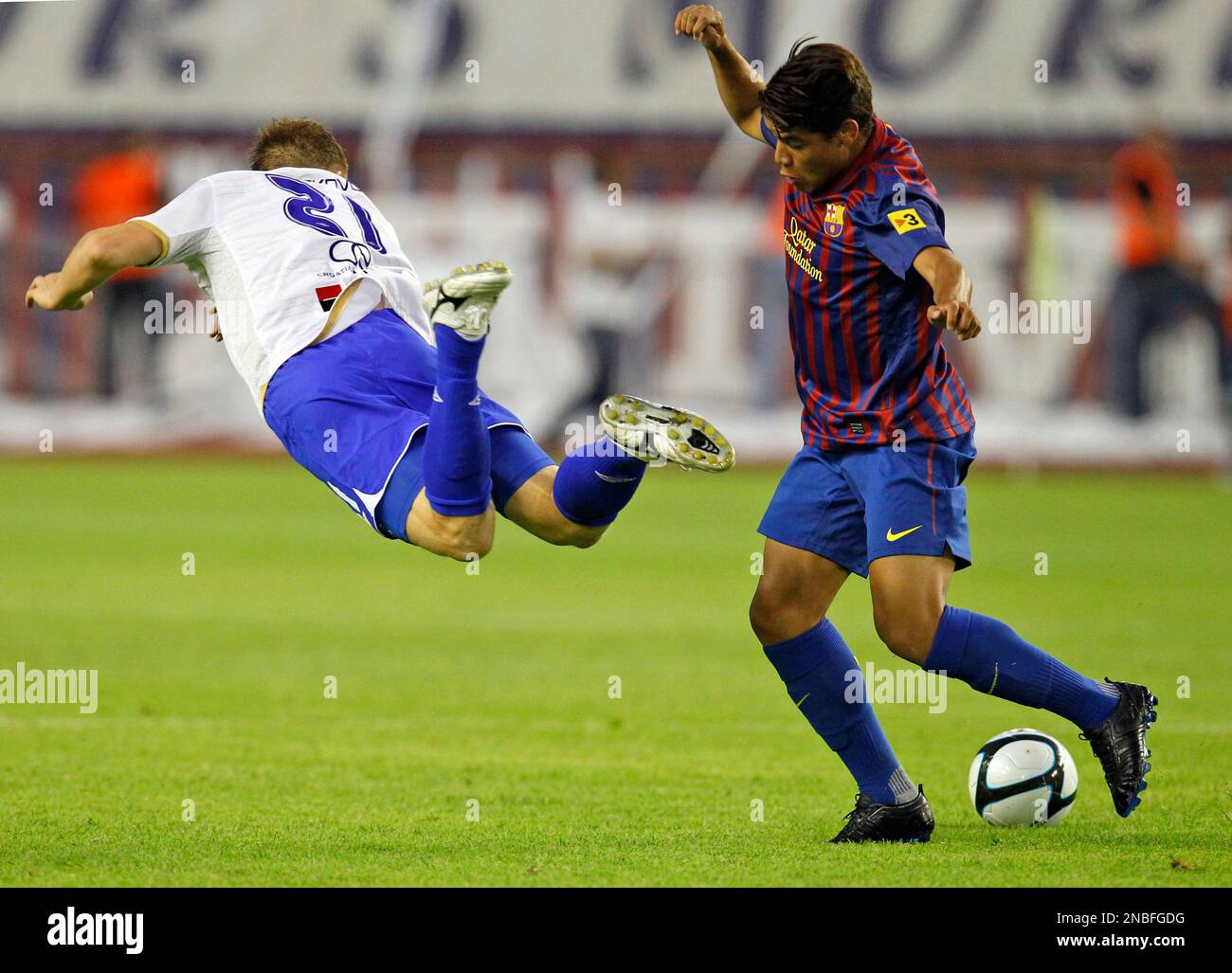 Barcelona's Armando Lozano, right, is challenged by Hajduk's Mario ...