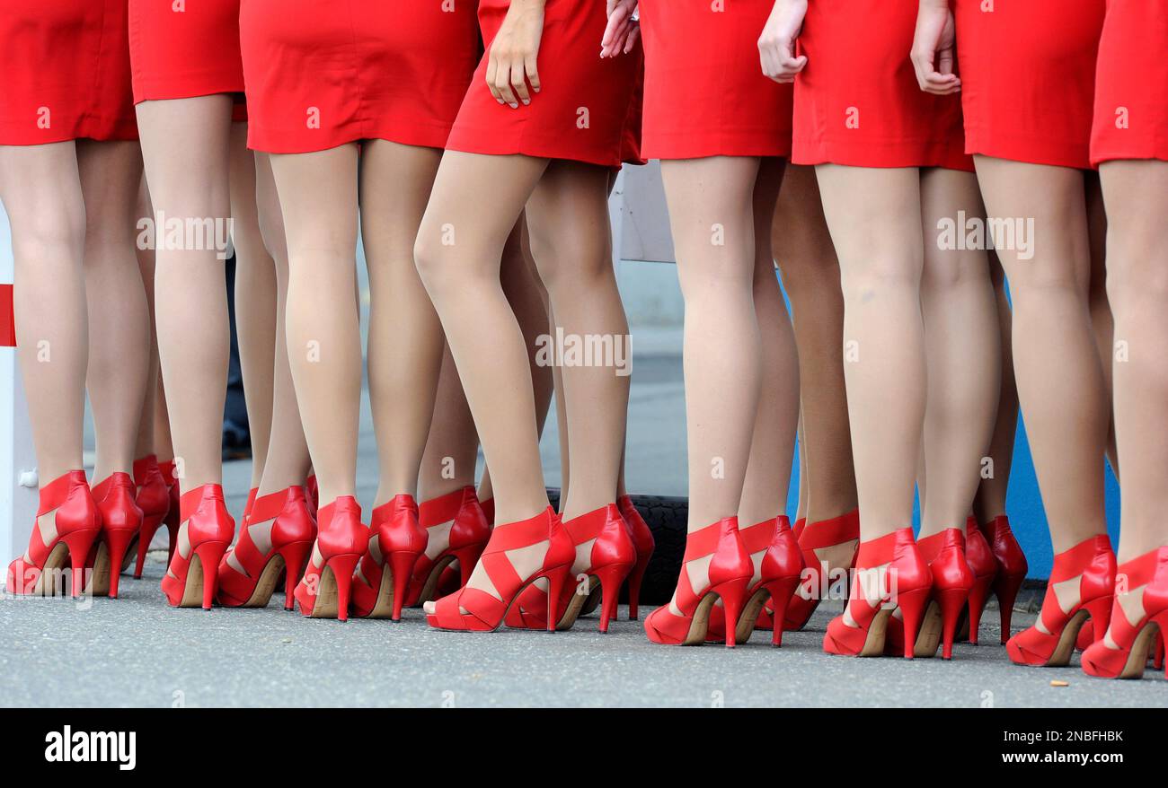 F1 hostesses in red shoes waiting after the F1 qualification of the ...