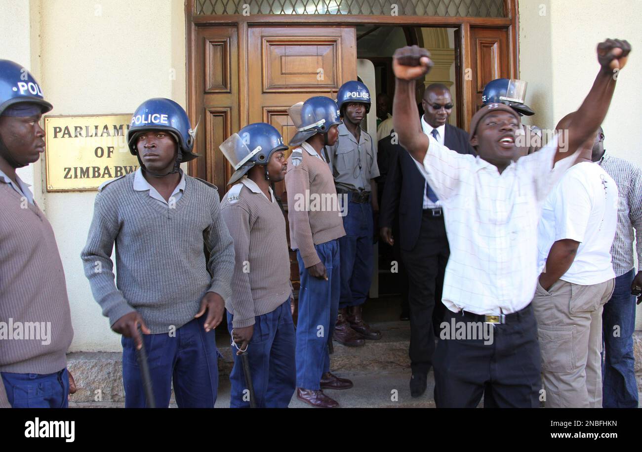 Members of the Zanu pf party chant as they leave the parliament ...