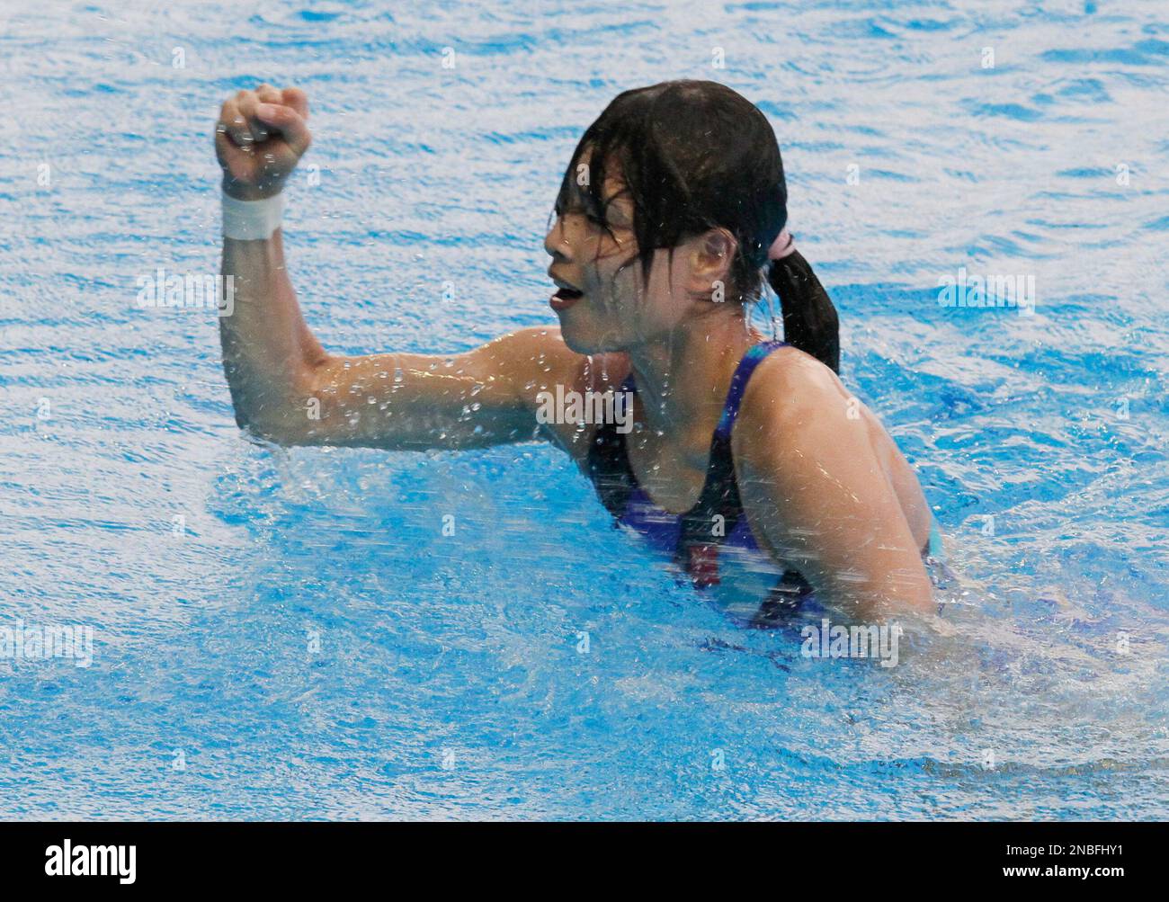 China's Wu Minxia reacts after her final dive in the women's 3-Meter ...
