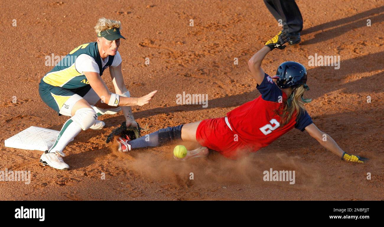 U.S. baserunner Kelly Grieve, right, gets to the base ahead of the ...