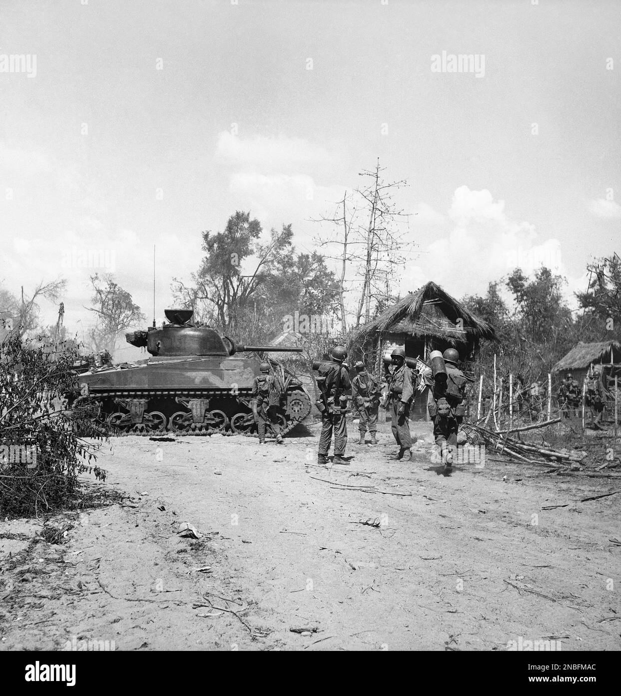 American medium tanks, (General Shermans) and troops move into the ...