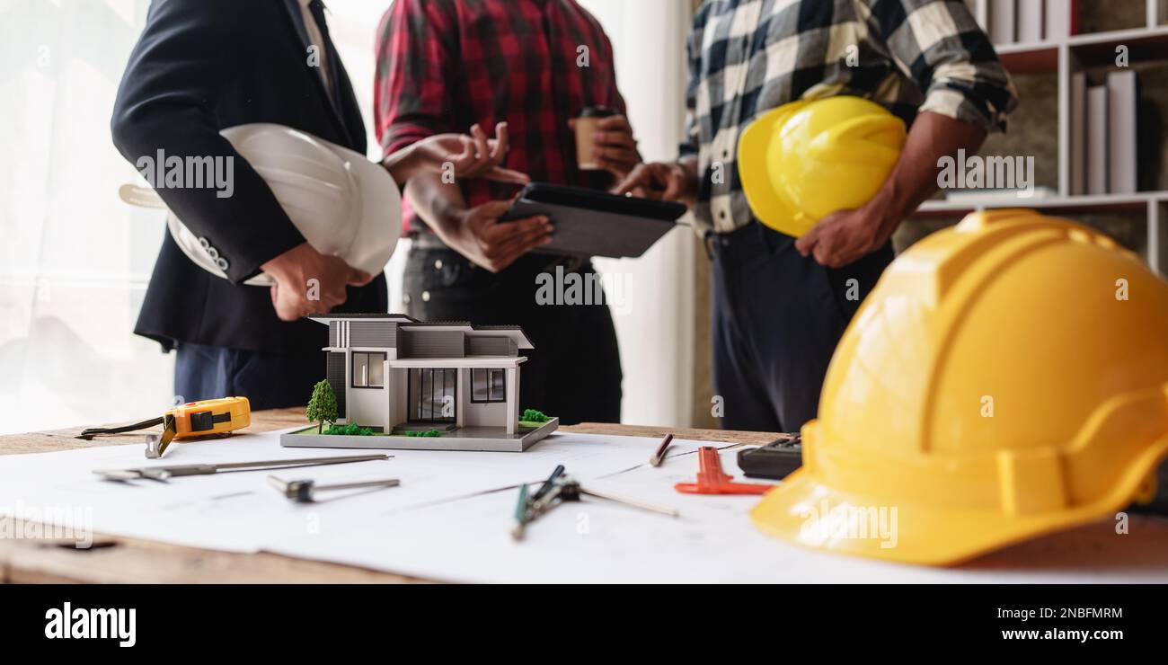 Group of professional engineering people brainstorming at meeting and ...