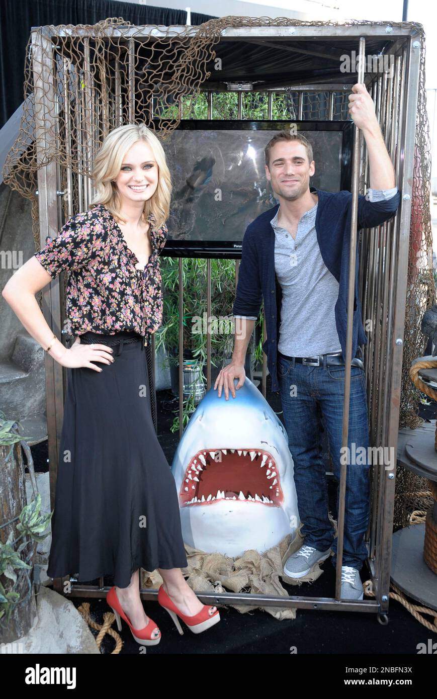 Actor Dustin Milligan and actress Sara Paxton pose together at the Shark Night 3D party at the ...