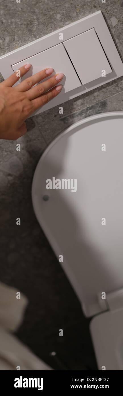 Toilet flushing buttons closeup hi-res stock photography and images - Alamy