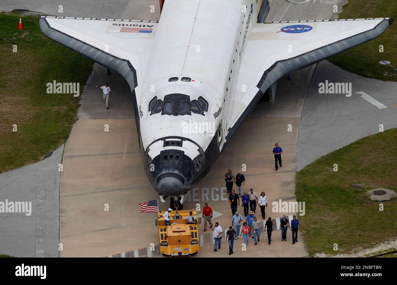 Space shuttle Atlantis is towed to the Orbitor Processing facility for ...