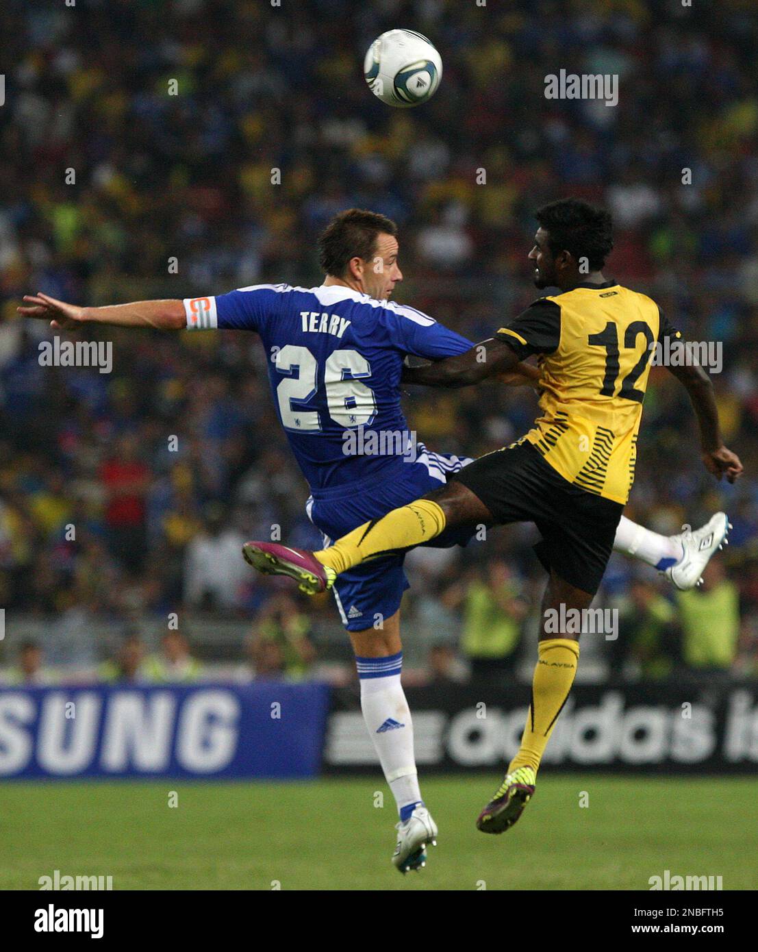 Chelsea FC player John Terry, left, and Malaysia's Gary Steven Robbat ...