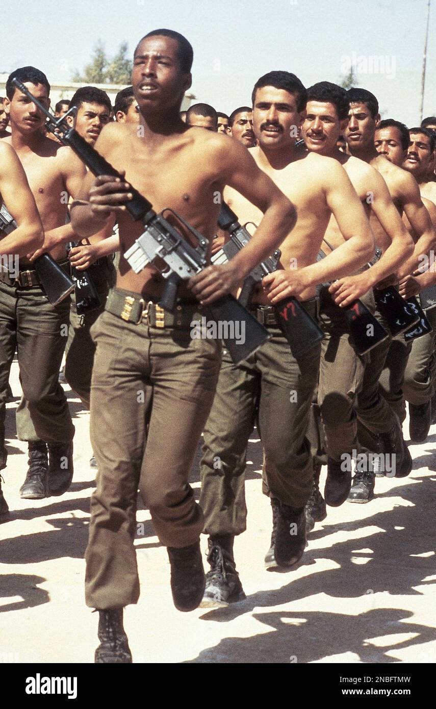 Soldiers of the Palestine Liberation Army exercise with automatic ...