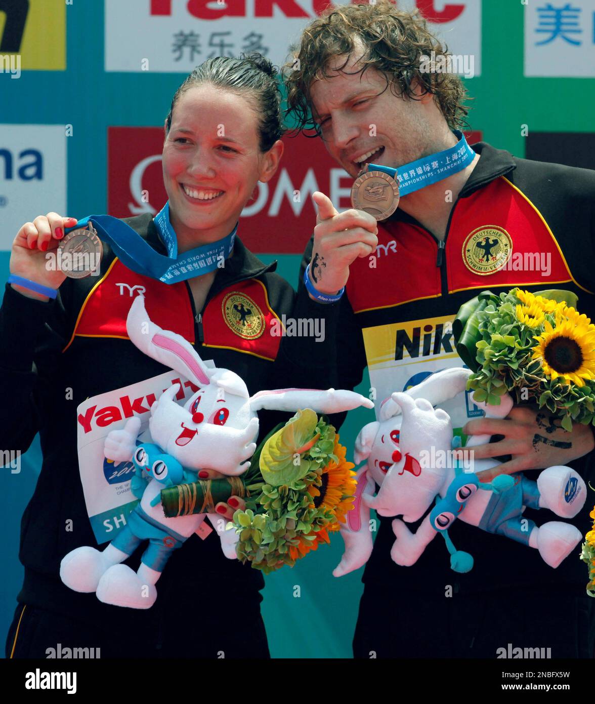 Bronze medalists Germany's Jan Wolfgarten, right, and Isabelle Haerle ...