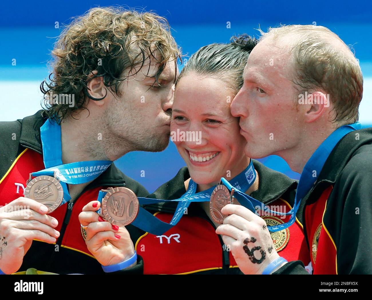 From left, bronze medalists Germany's Jan Wolfgarten, Isabelle Haerle ...
