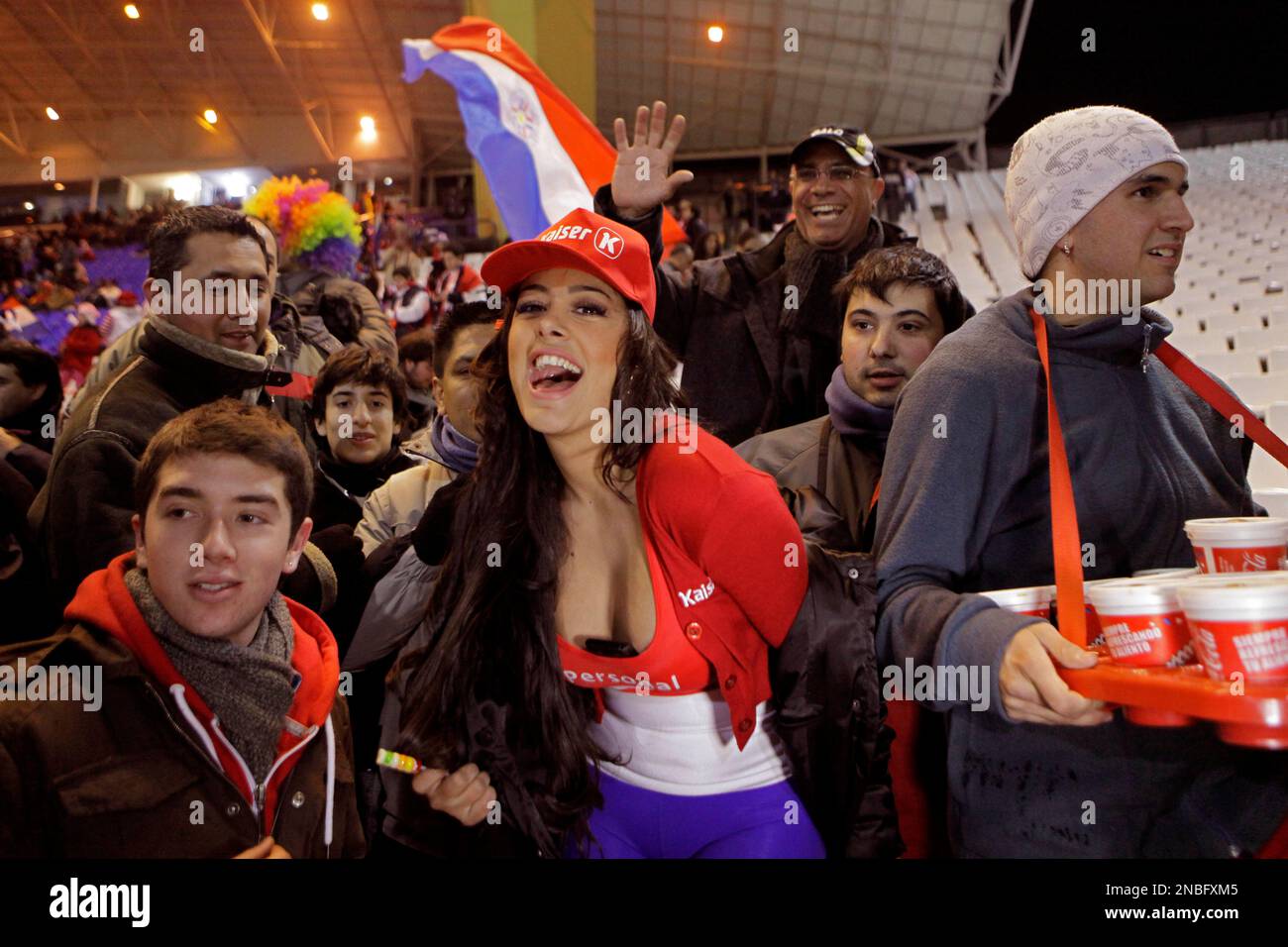 Paraguay's notorious soccer fan Larissa Riquelme, center, cheers before ...