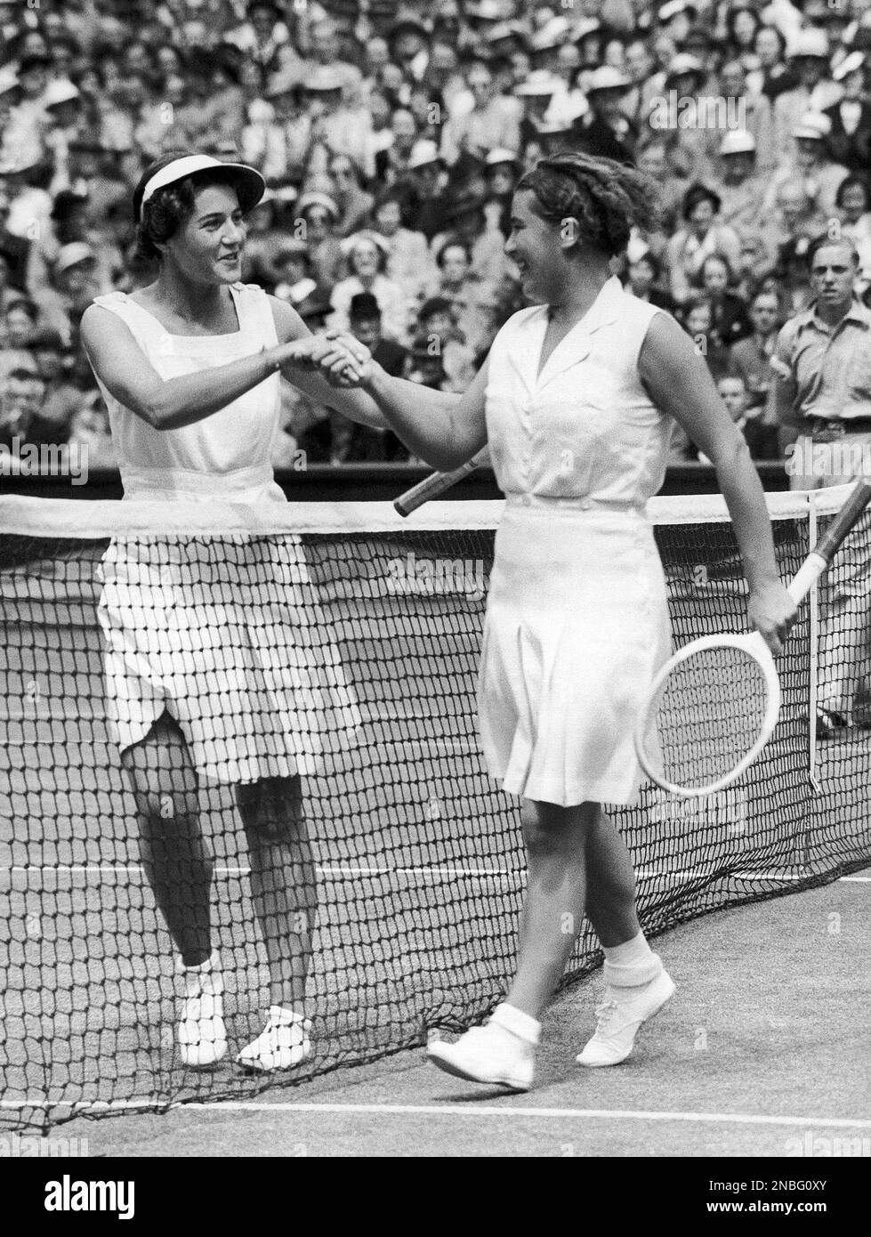 Miss Margaret Scriven and Panna Jedrzejowska shaking hands after their ...