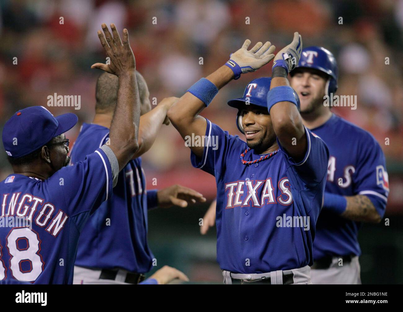 Texas Rangers' Endy Chavez, right, is greeted by manager Ron Washington ...