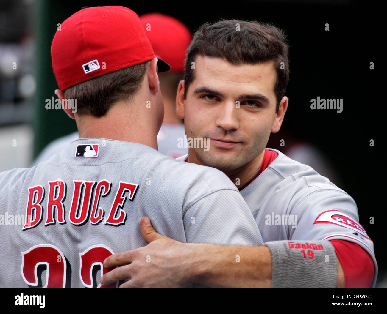 Cincinnati Reds' Joey Votto, right, hugs teammate, Jay Bruce in the ...