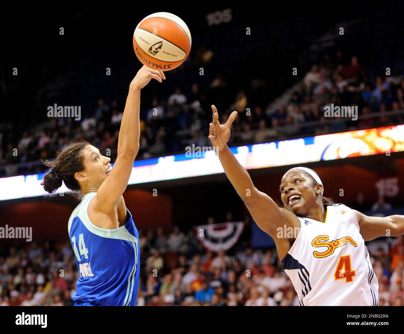 Connecticut Sun's Danielle McCray, right, reaches for a rebound against ...