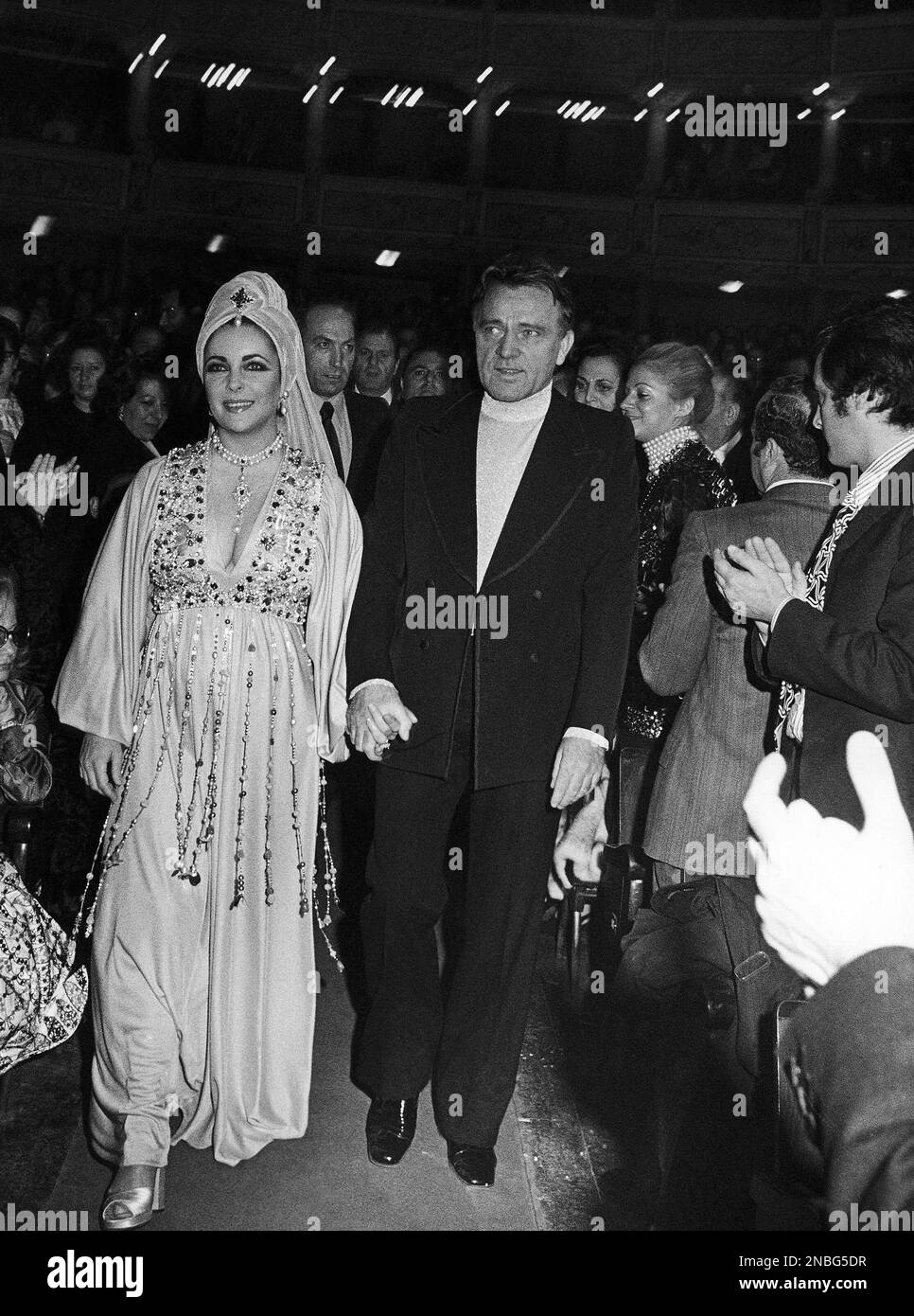 British-born American actress Elizabeth Taylor and her husband, Welsh actor Richard Burton enter ...