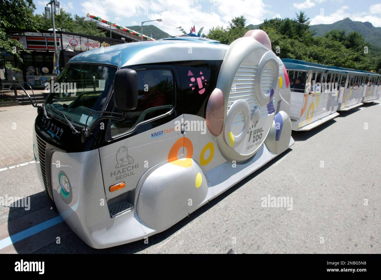 The Online Electric Vehicle (OLEV), towing three carriages, moves along ...