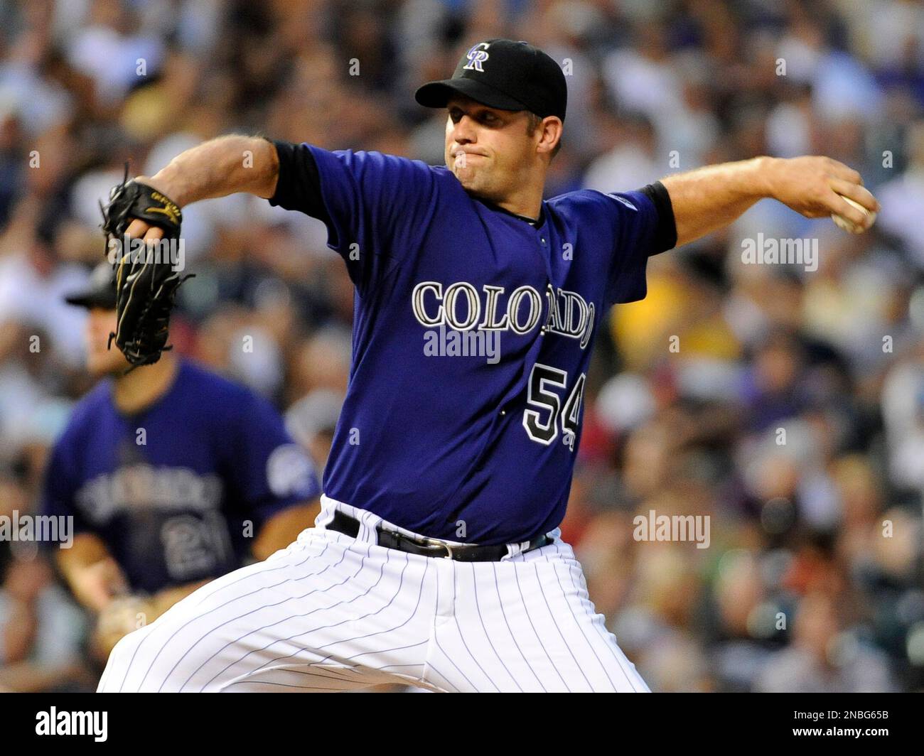 Colorado Rockies starting pitcher Eric Stults throws to the plate ...