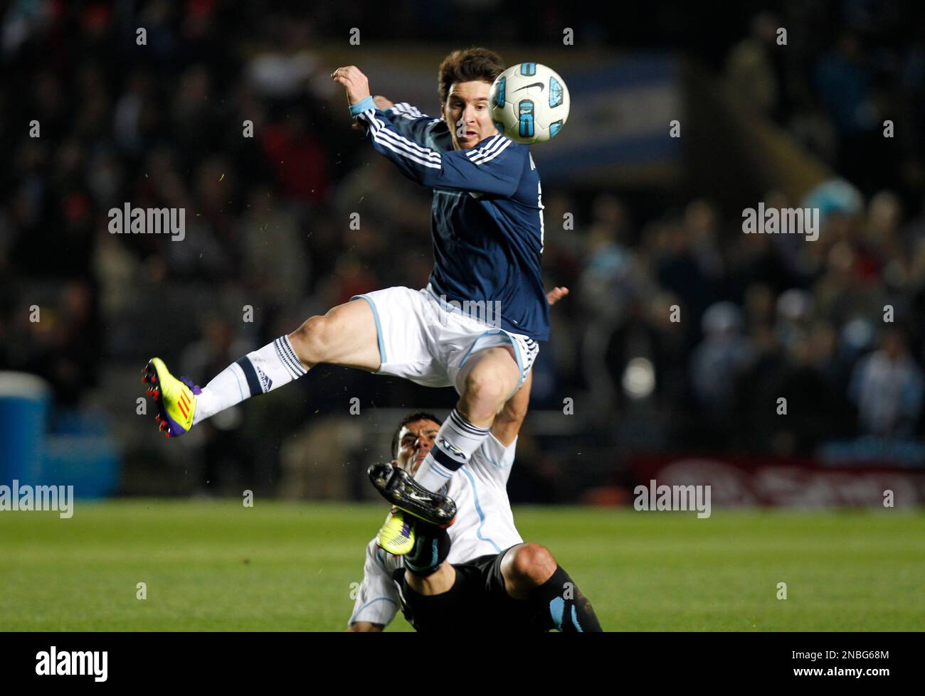 Argentina's Lionel Messi is fouled by Uruguay's Maximiliano Pereira ...