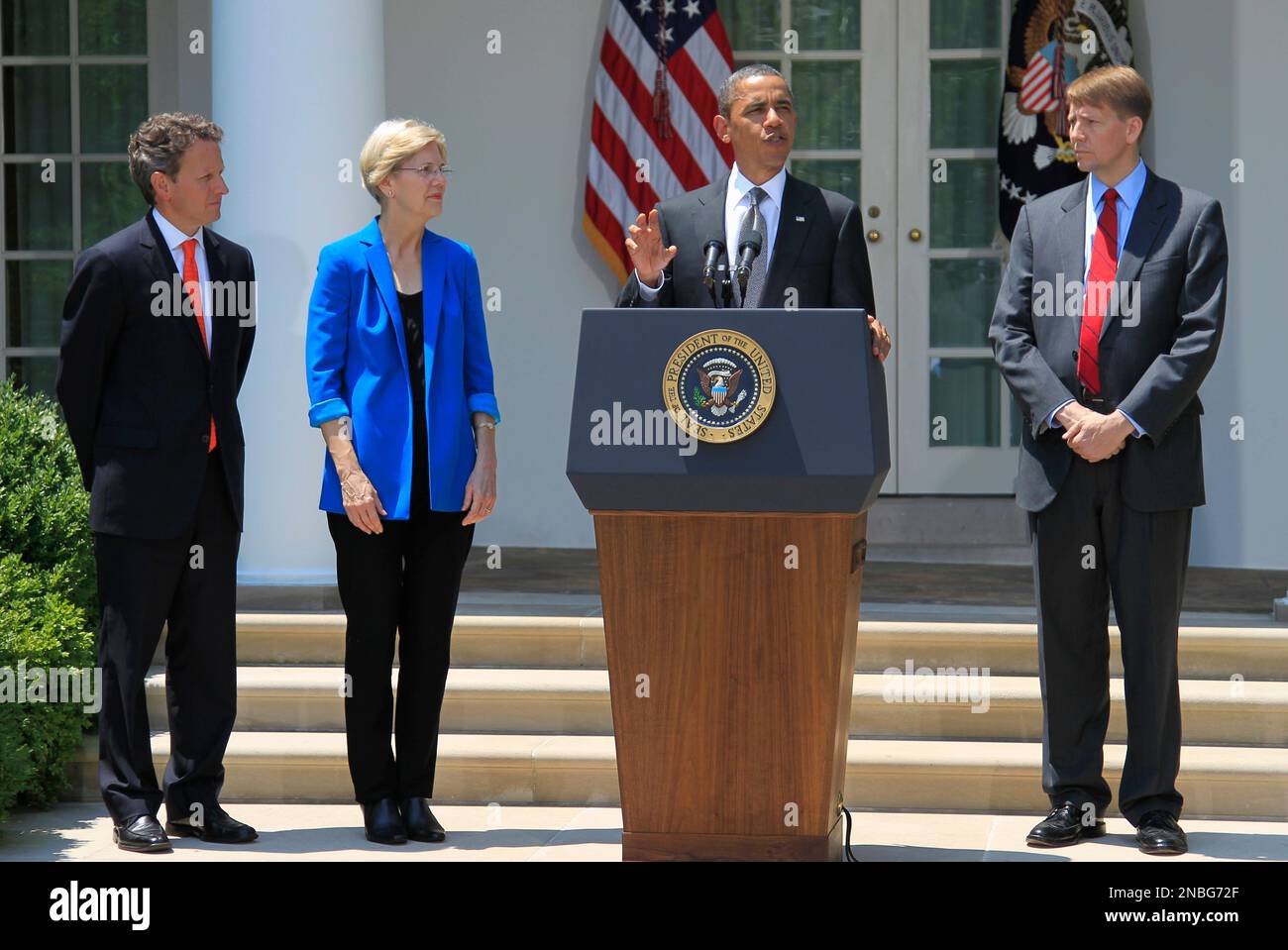 President Barack Obama, with, from left, Treasury Secretary Tim ...