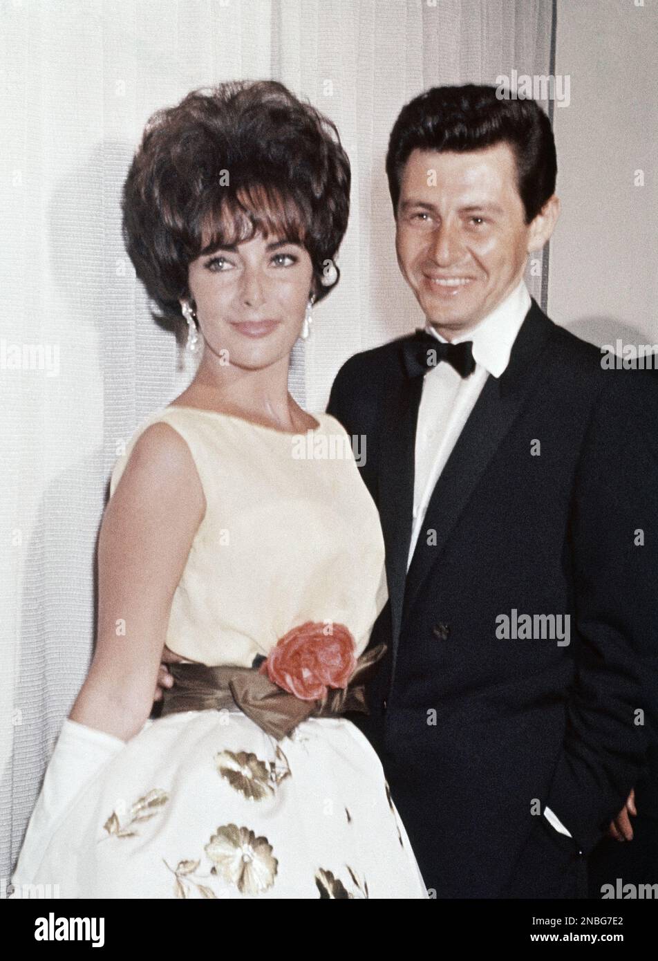 British actress Elizabeth Taylor poses with husband singer Eddie Fisher ...