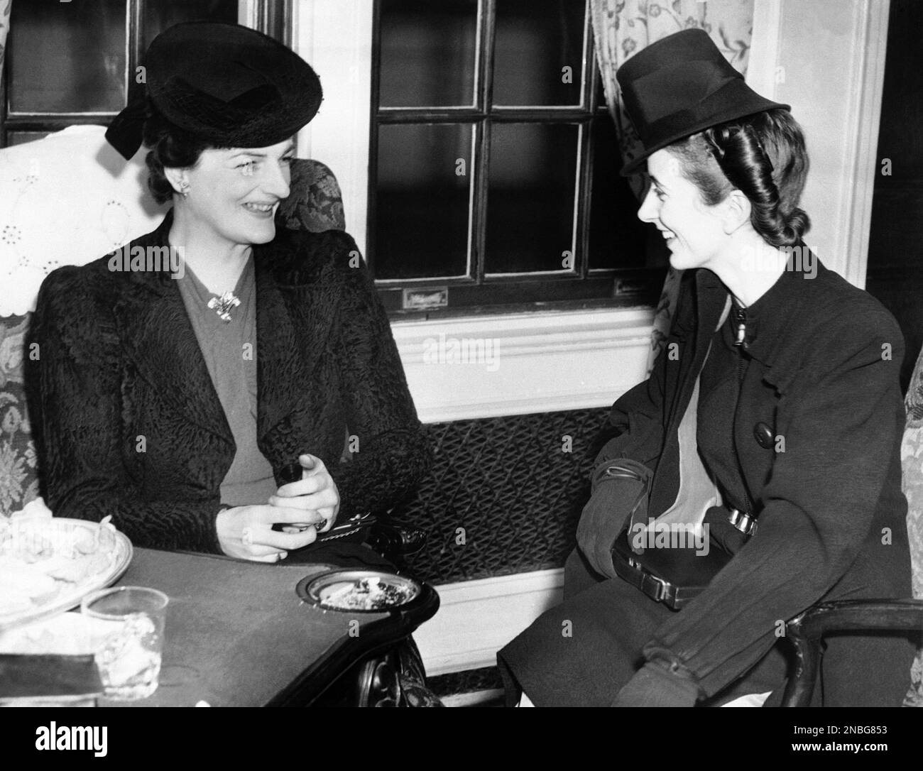 Beatrice Eden, wife of the former Foreign Secretary, left, chatted with ...