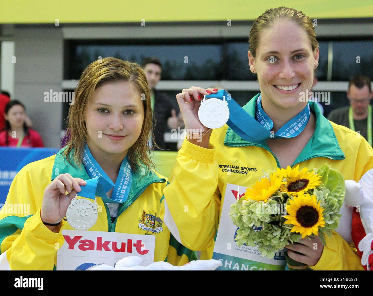 Australia's Alexandra Croak, right, and Melissa Wu hold up their silver ...