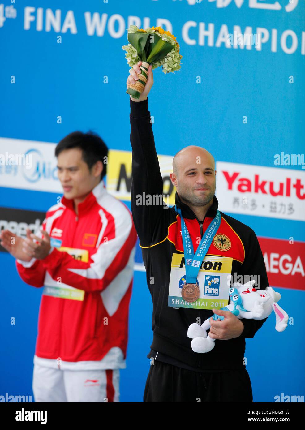 Germany's Pavlo Rozenberg waves from the podium after receiving his ...