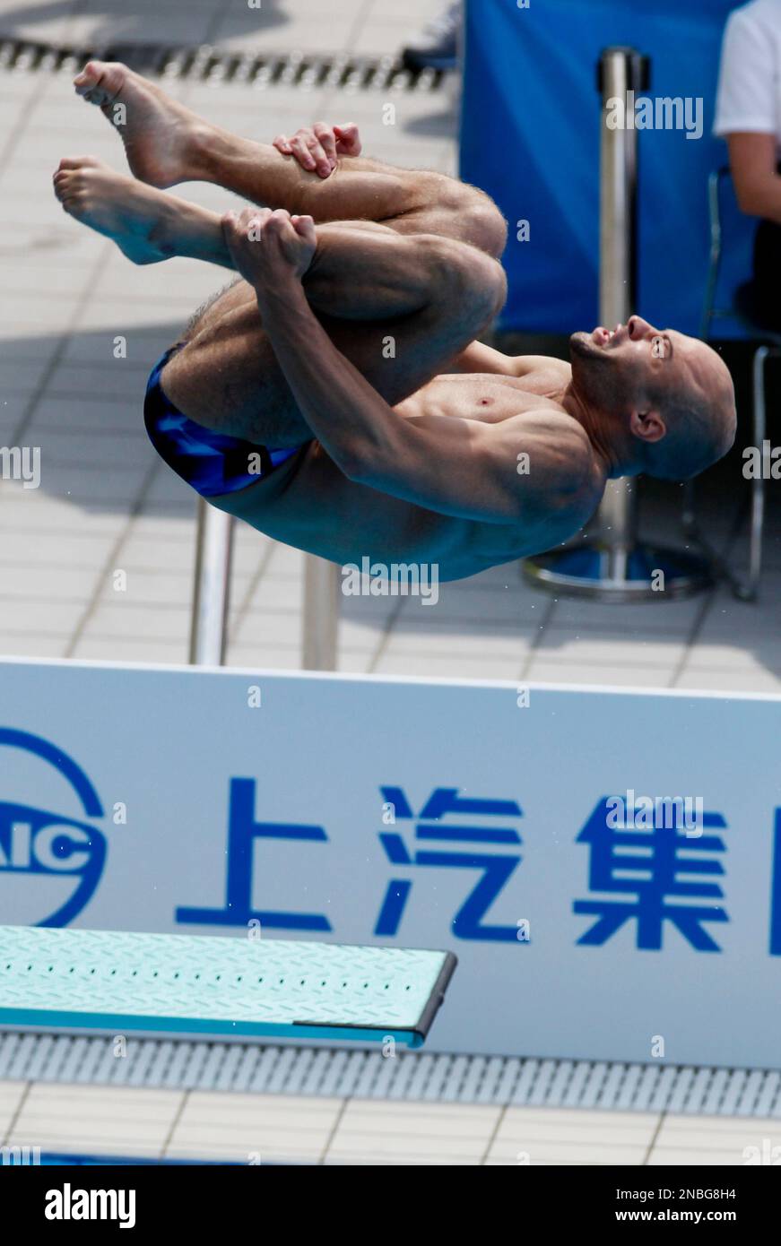 Germany's Pavlo Rozenberg dives during the men's 1-meter Springboard ...