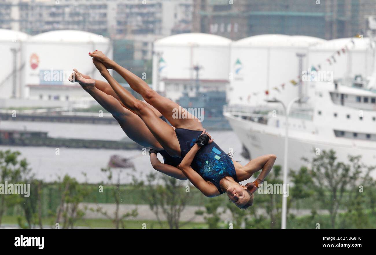 Villo Kormos and Zsofia Resinger of Hungary dive during the Women's 10m Synchro Platform event ...