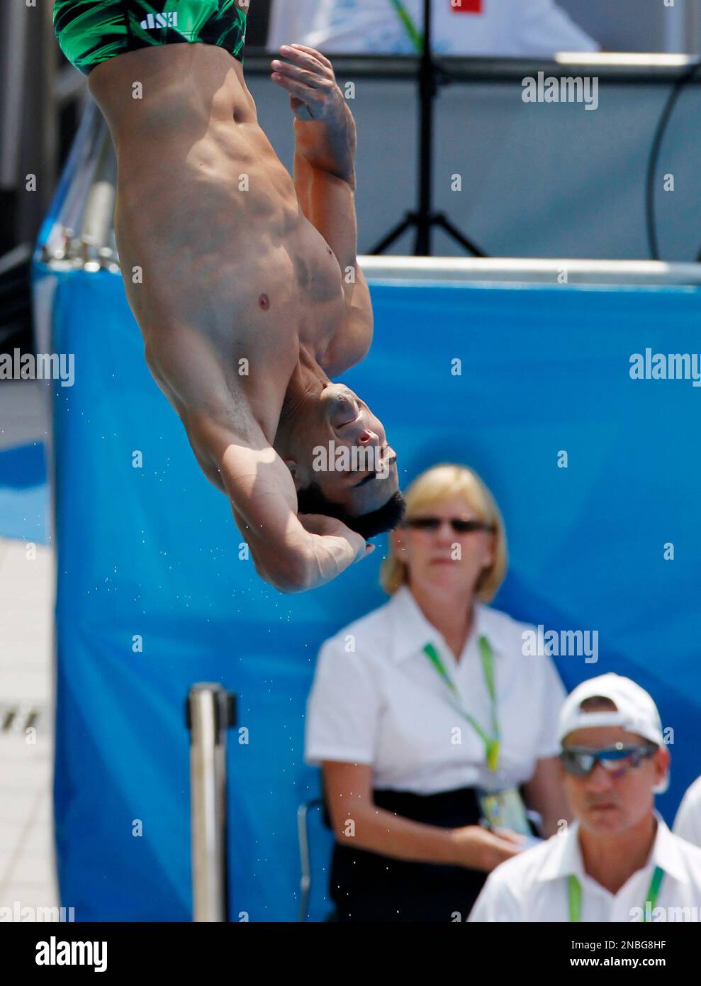 Mexico's Daniel Islas dives during the men's 1-meter Springboard final ...
