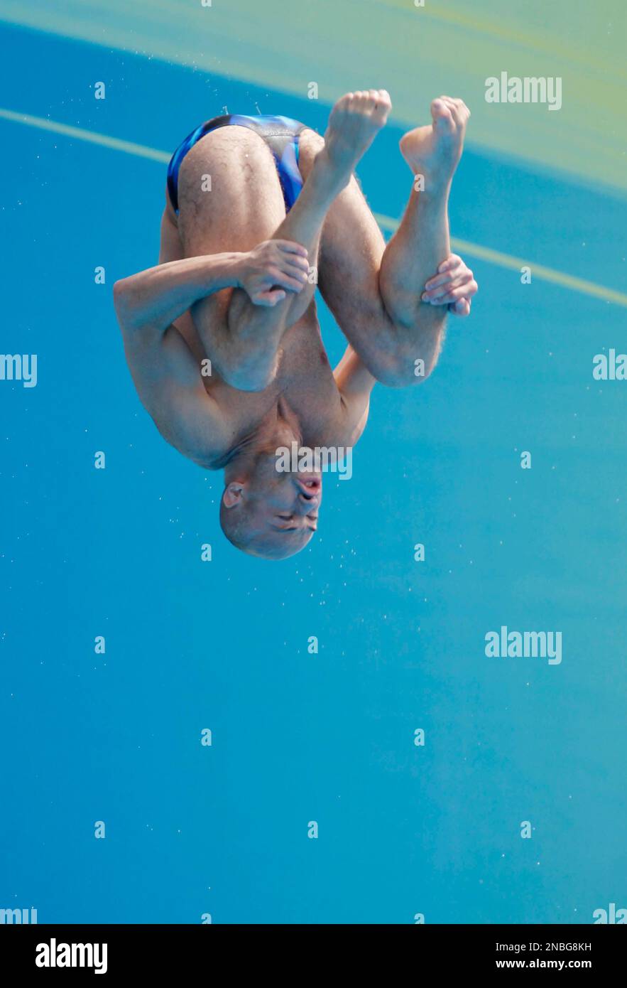 Germany's Pavlo Rozenberg dives during the men's 1-meter Springboard ...