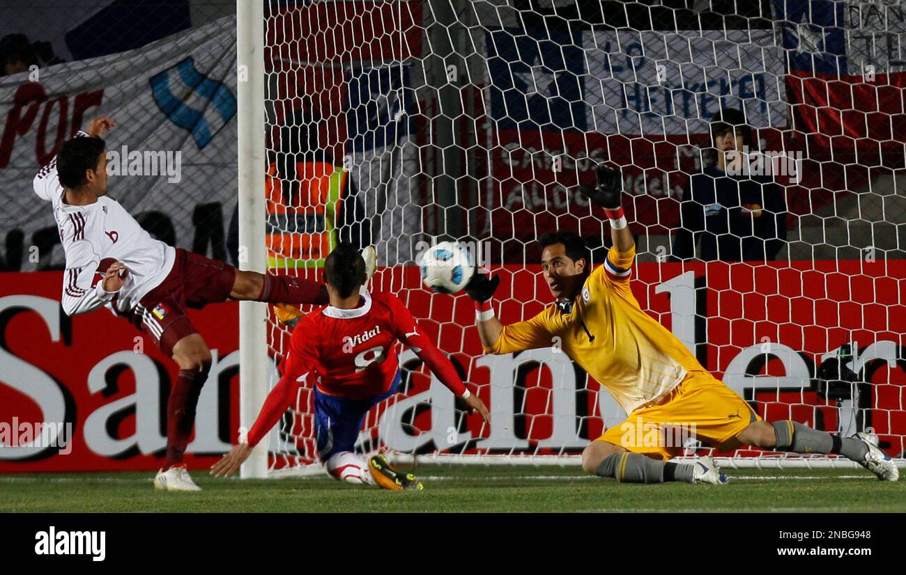 Venezuela's Gabriel Cichero, left, scores the winning goal as Chile's ...