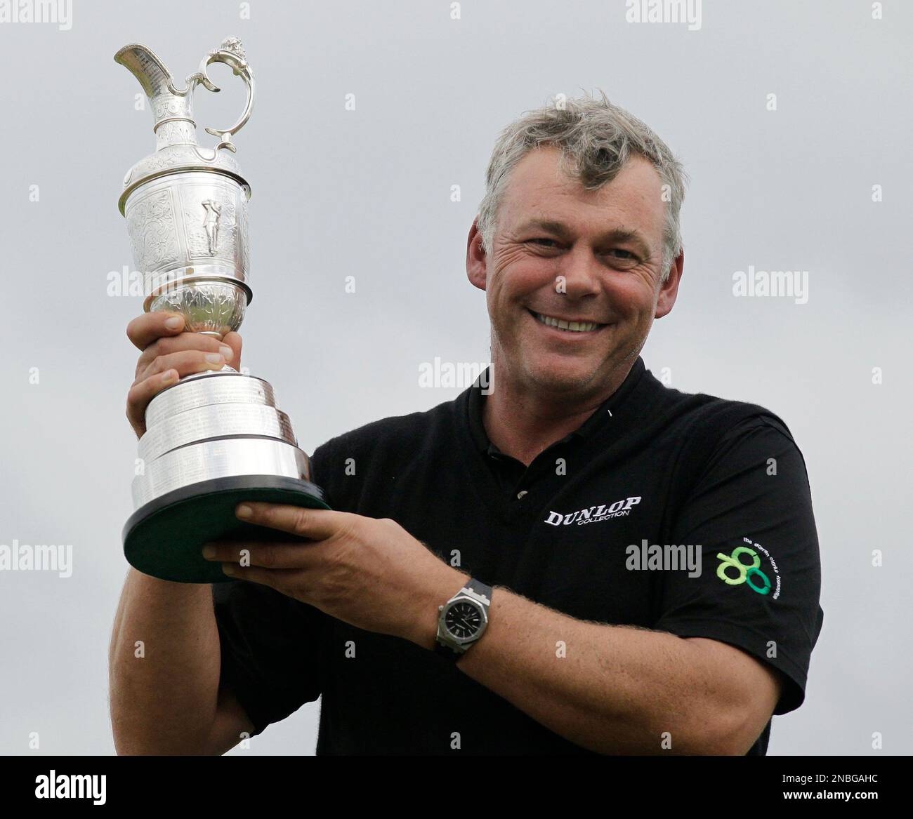 Northern Ireland's Darren Clarke holds the Claret Jug trophy as he ...