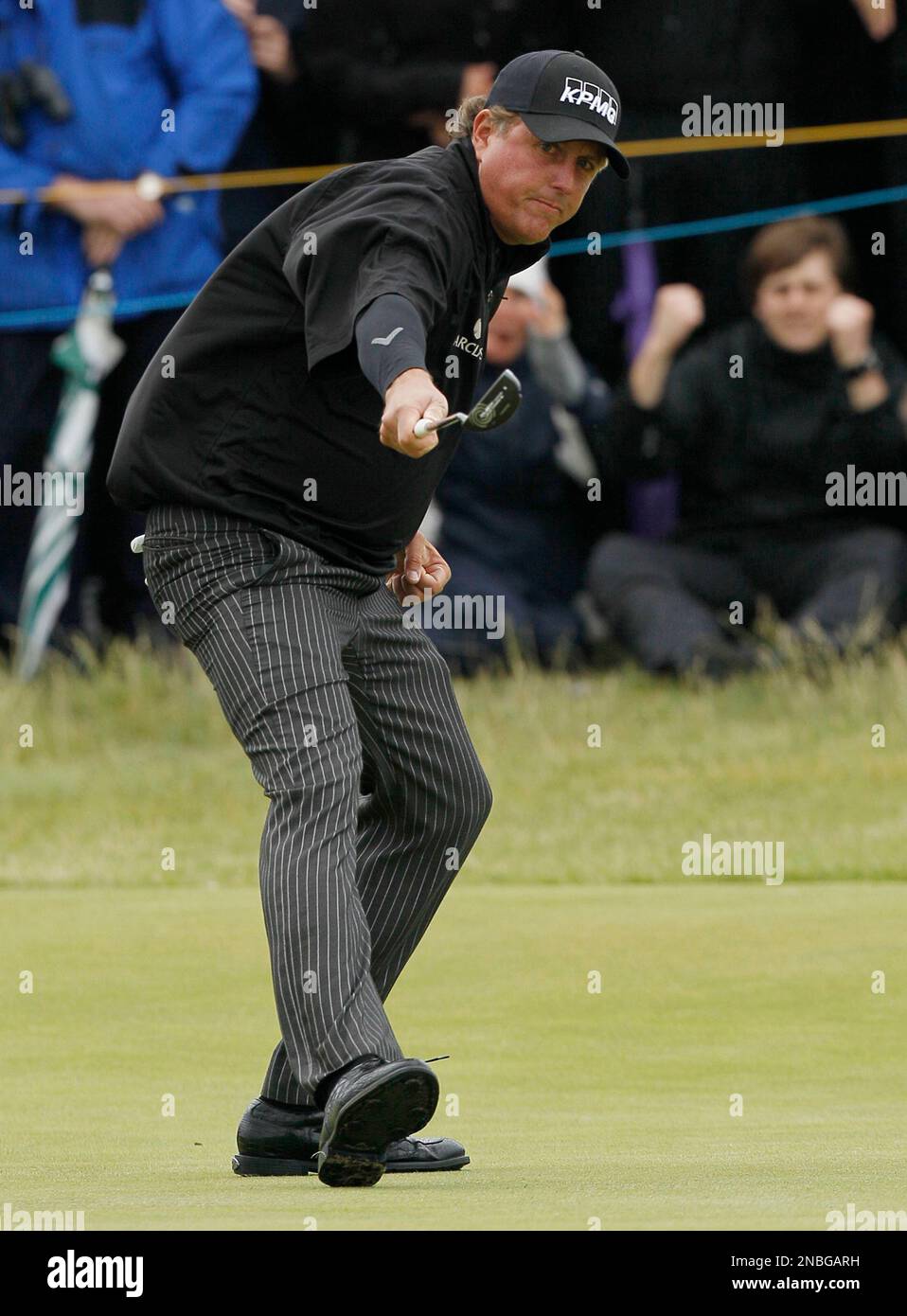 Phil Mickelson of the US reacts after putting an eagle on the 7th green ...