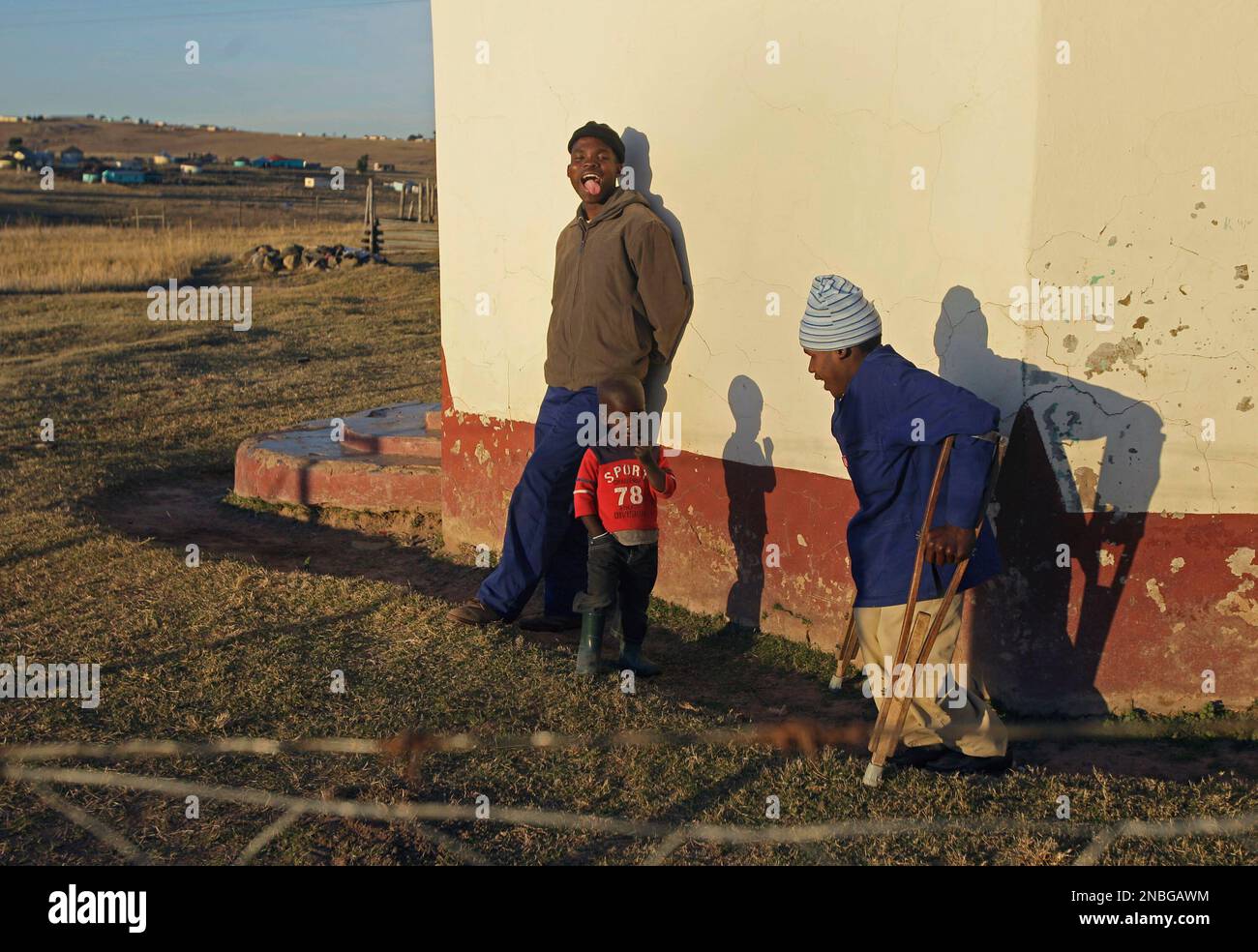 Men interact at their house near former South African President Nelson ...