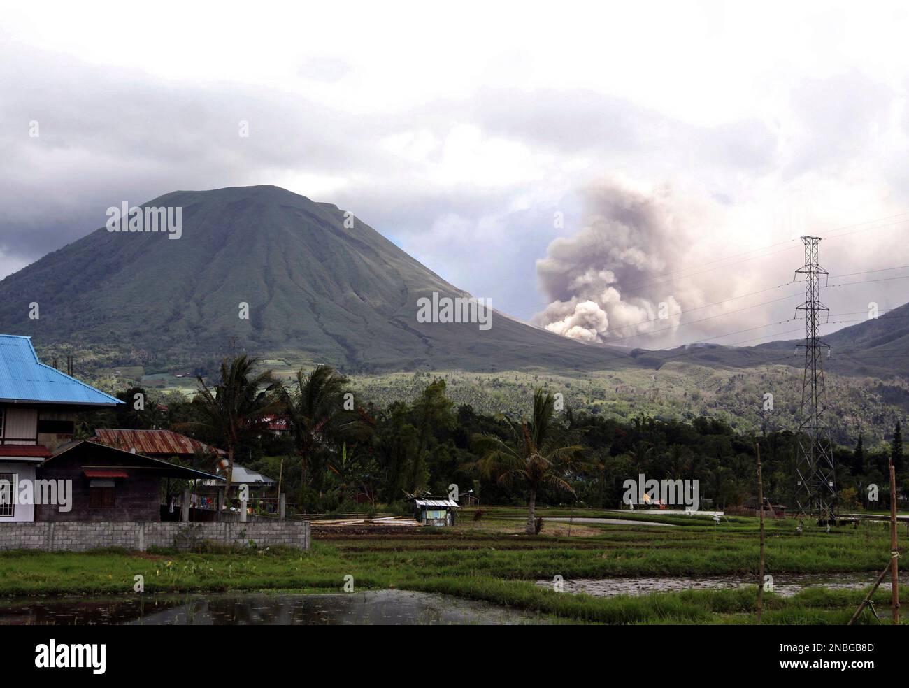 Mount Lokon spews volcanic ash as seen from Tomohon, North Sulawesi ...