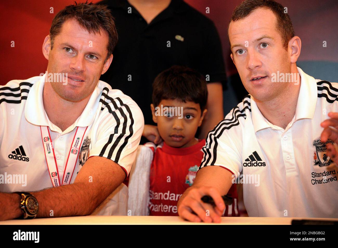 Liverpool FC players Jamie Carragher, left, and Charlie Adam, right ...