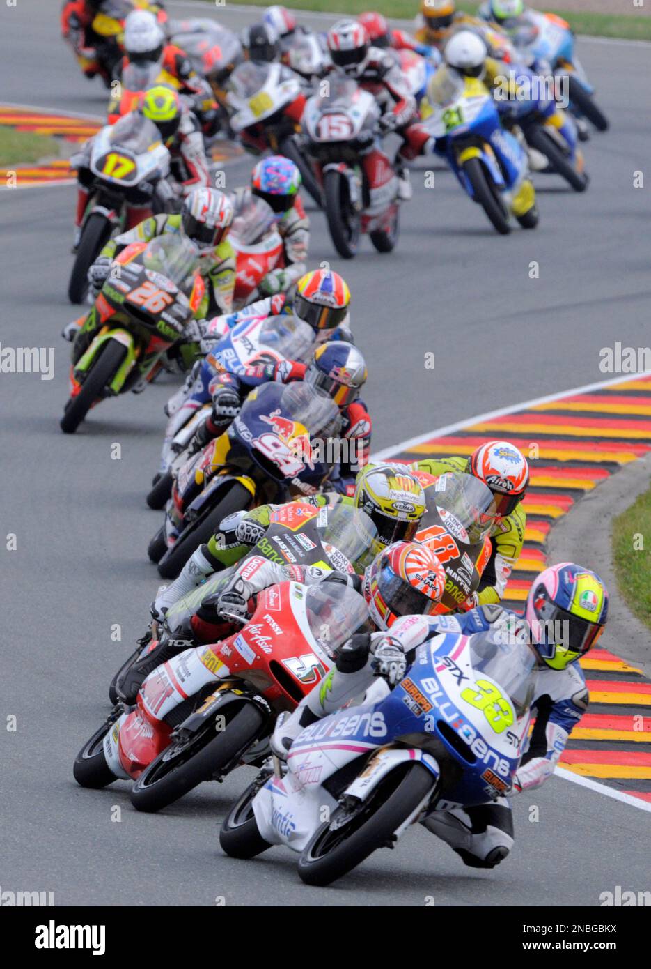 Riders compete in the pack during the The Grand Prix of Germany 125cc ...