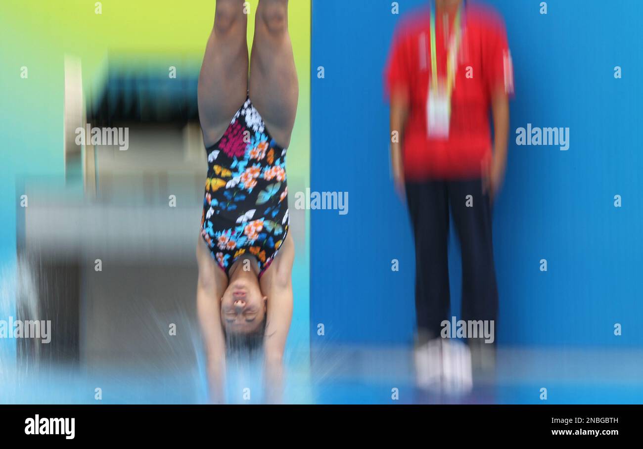 Sharon Chan of Hong Kong dives during the Women's 1m Springboard event ...