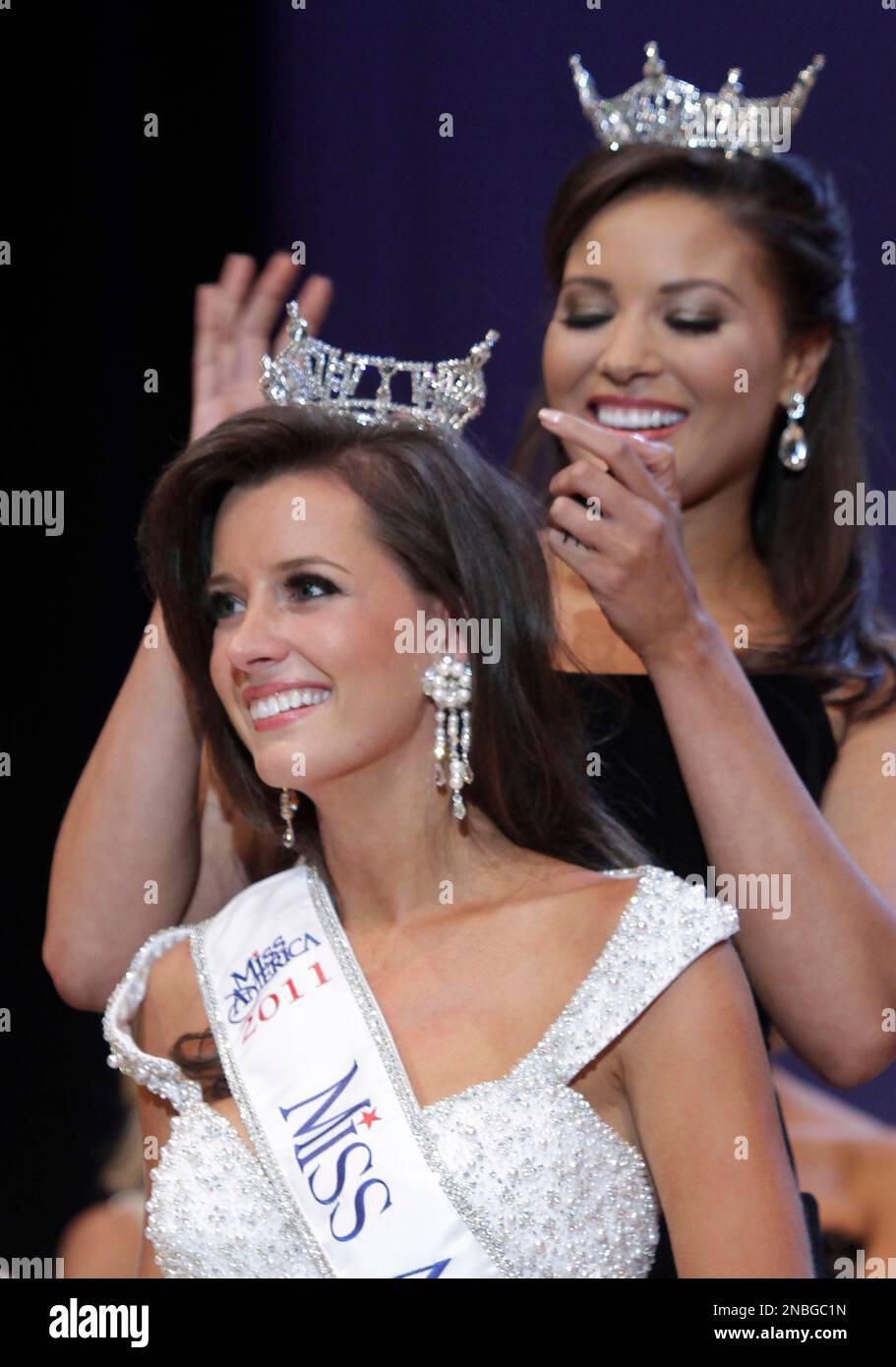 Kristin Glover, left, receives the crown from Alyse Eady at the Miss ...