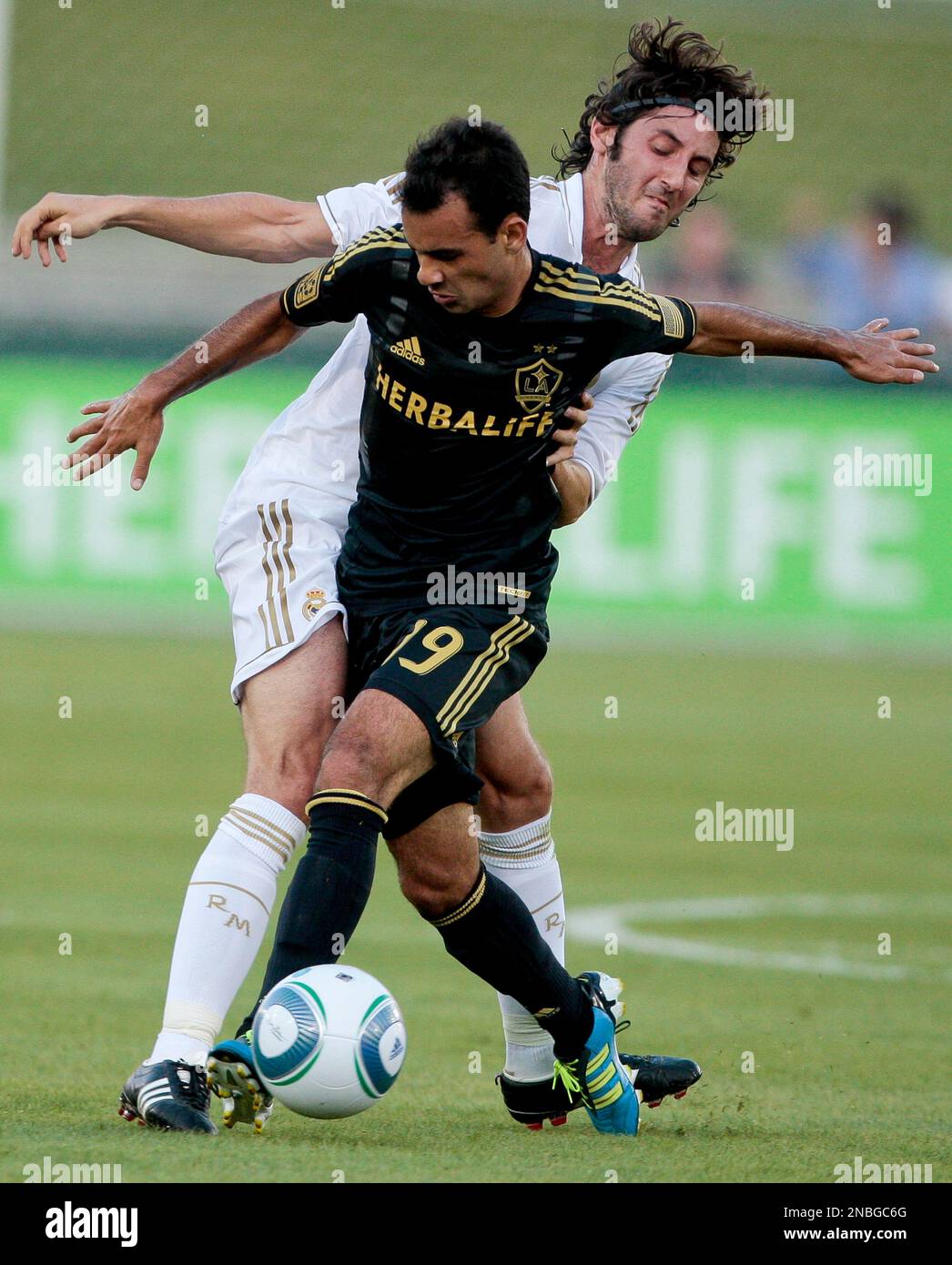 Los Angeles Galaxy midfielder Juninho, front, and Real Madrid's Esteban ...