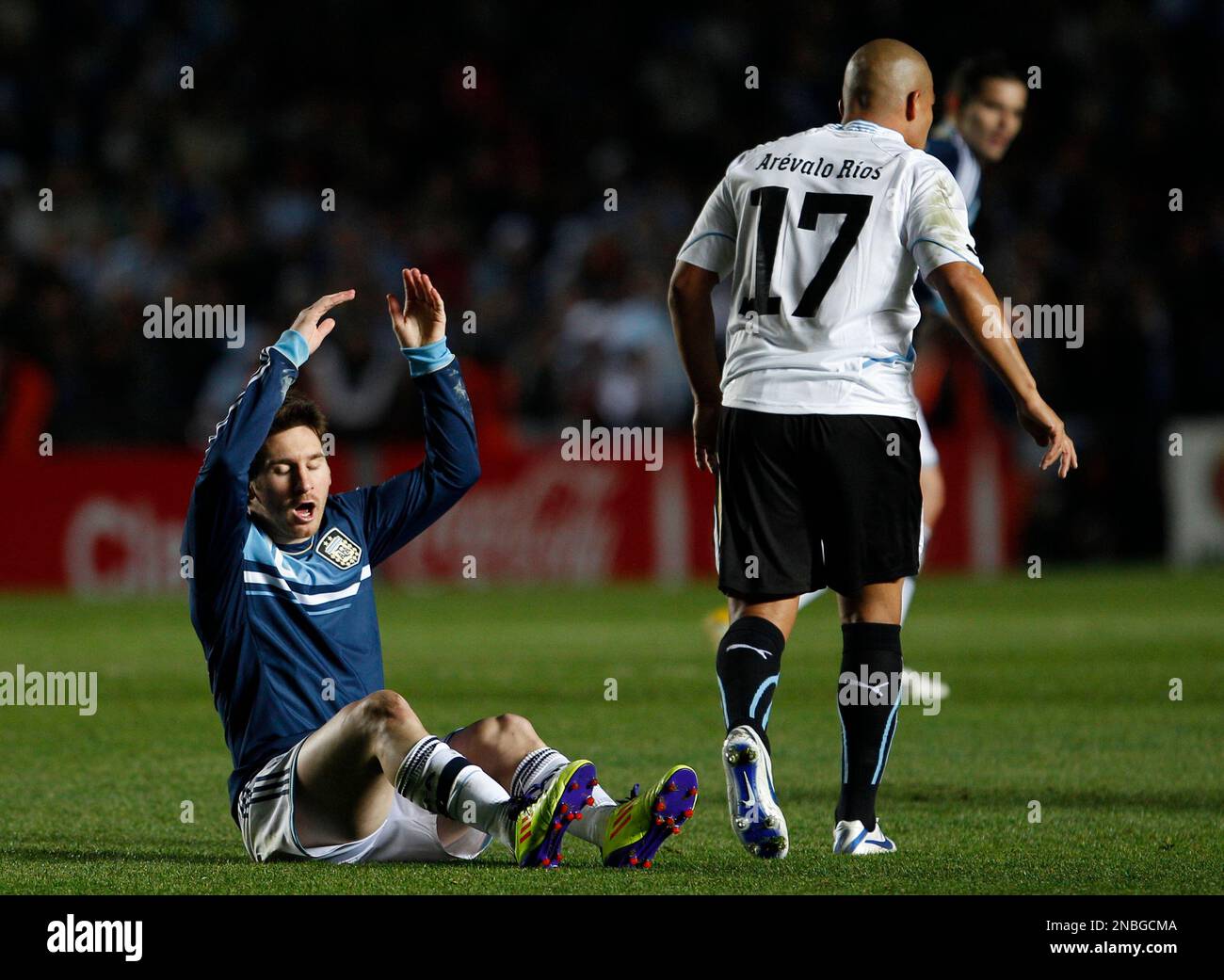 Argentina's Lionel Messi, left, reacts with displeasure after being ...