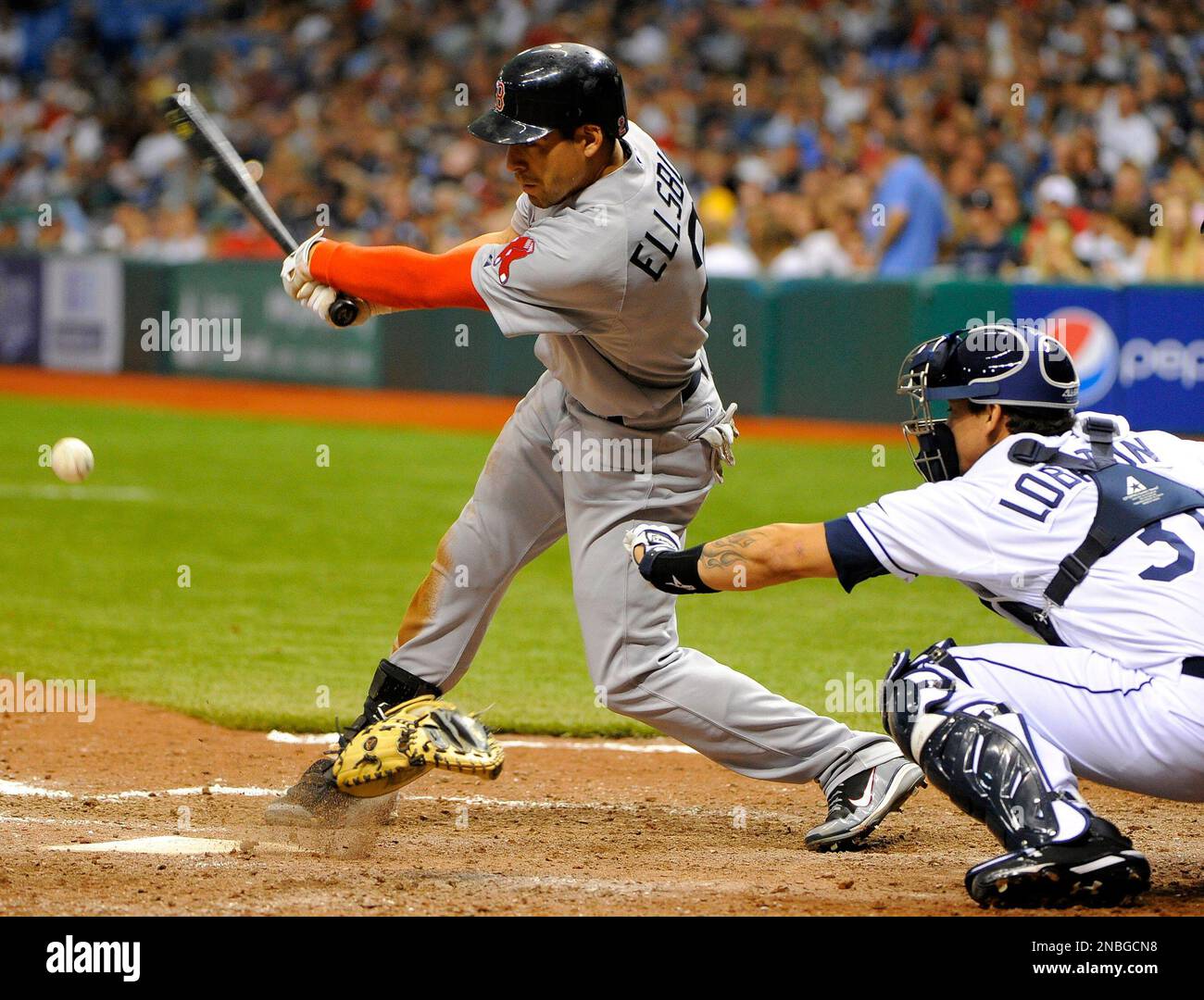 Tampa Bay Rays catcher Jose Lobaton, right, has his glove hit from his ...