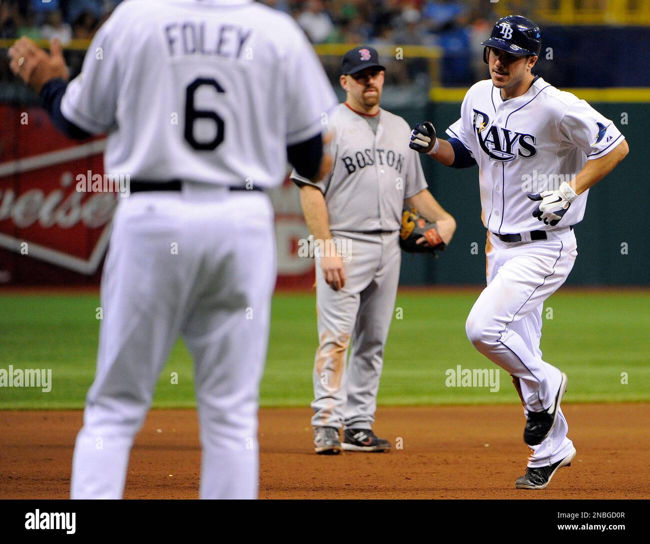 Tampa Bay Rays' Matt Joyce, right, rounds the bases after hitting a ...